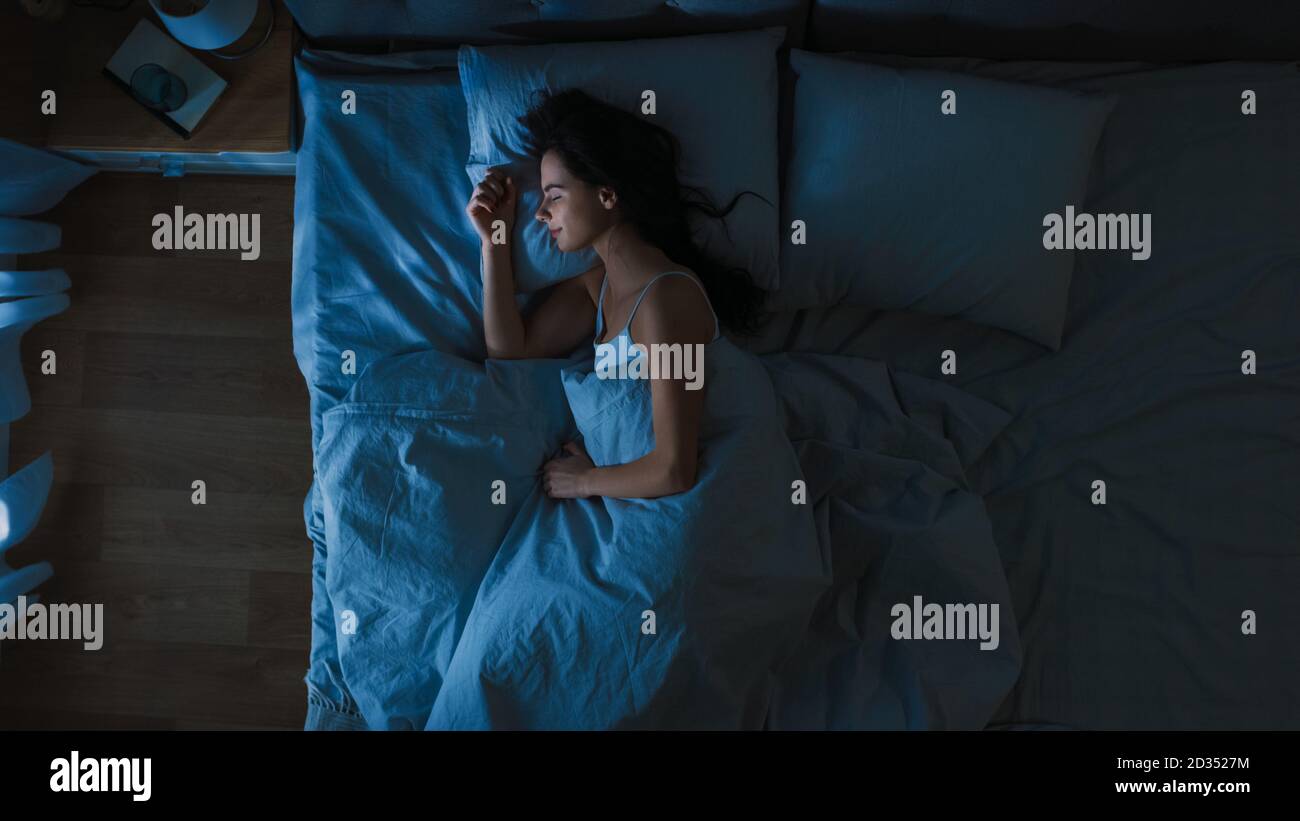 Top View of Beautiful Young Woman Sleeping Cozily on a Bed in His ...