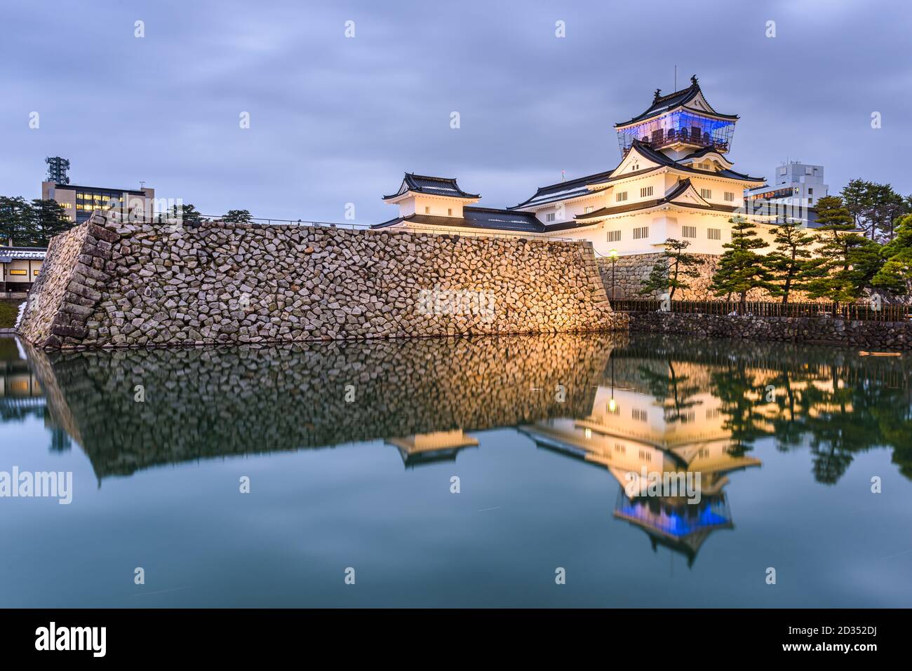Toyama, Japan at Toyama Castle from the moat at twilight Stock Photo ...