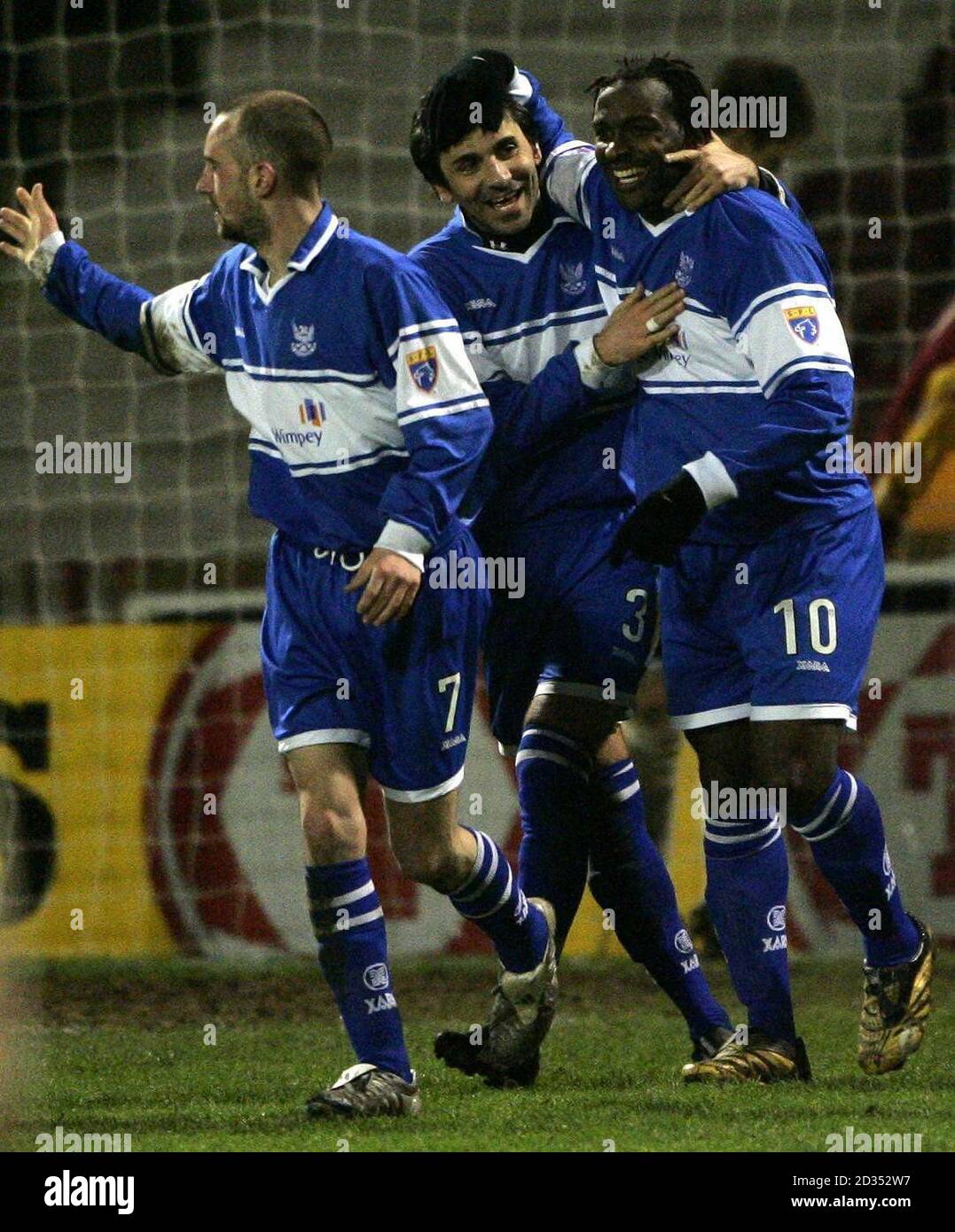 St Johnstone's Jason Scotland (right) celebrates with Goran Stanic and ...