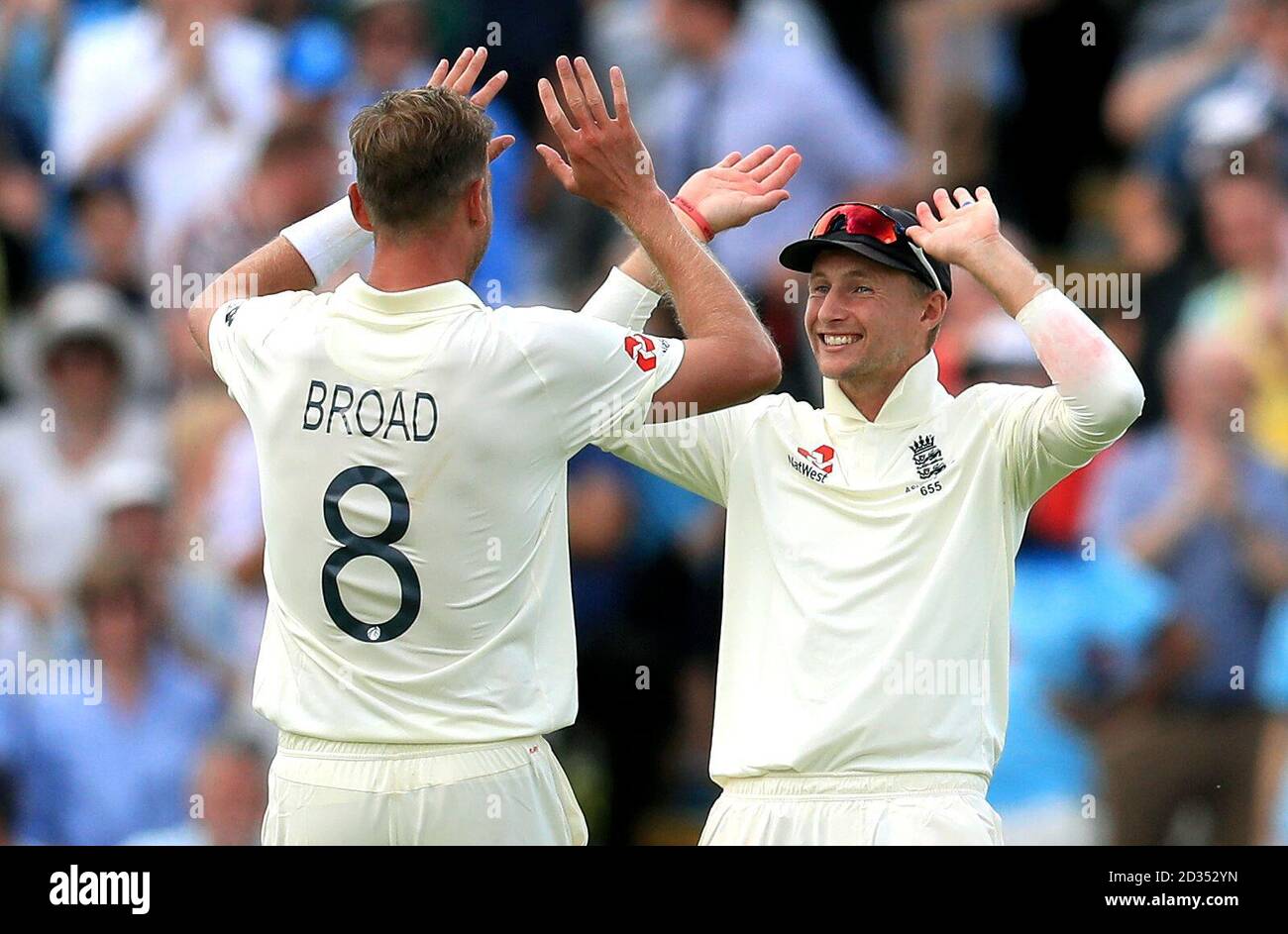 England's Stuart Broad (left) celebrates taking the wicket of Australia ...