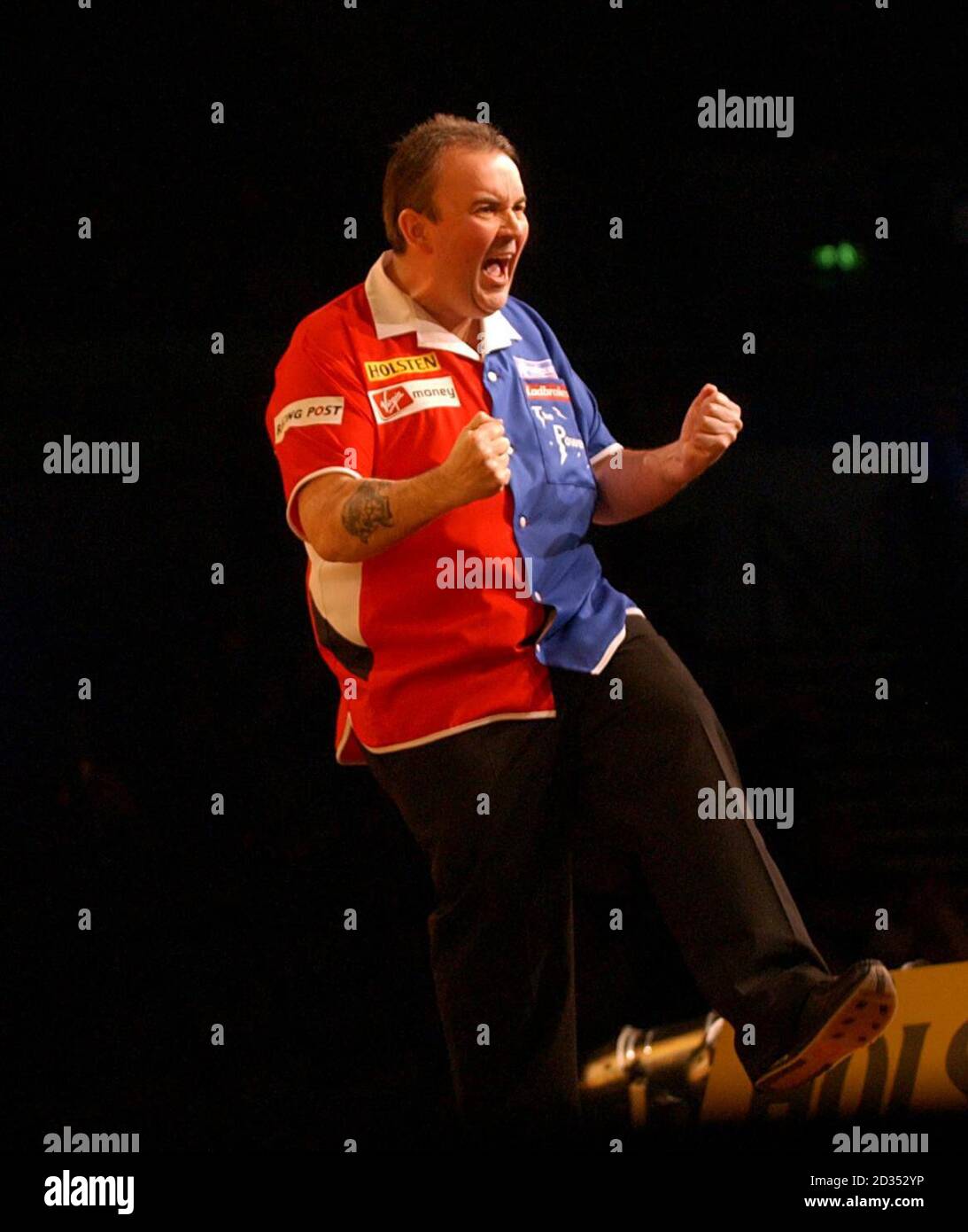 England's Phil Taylor celebrates after leveling sets with Netherlands ...