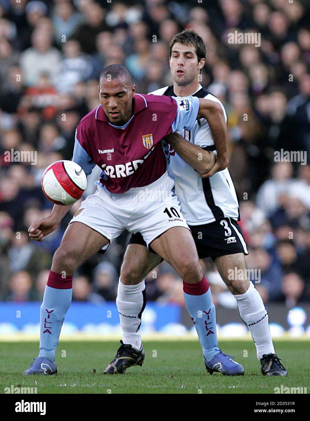 Fulham's Carlos Bocanegra and Aston Villa's John Carew in action Stock ...