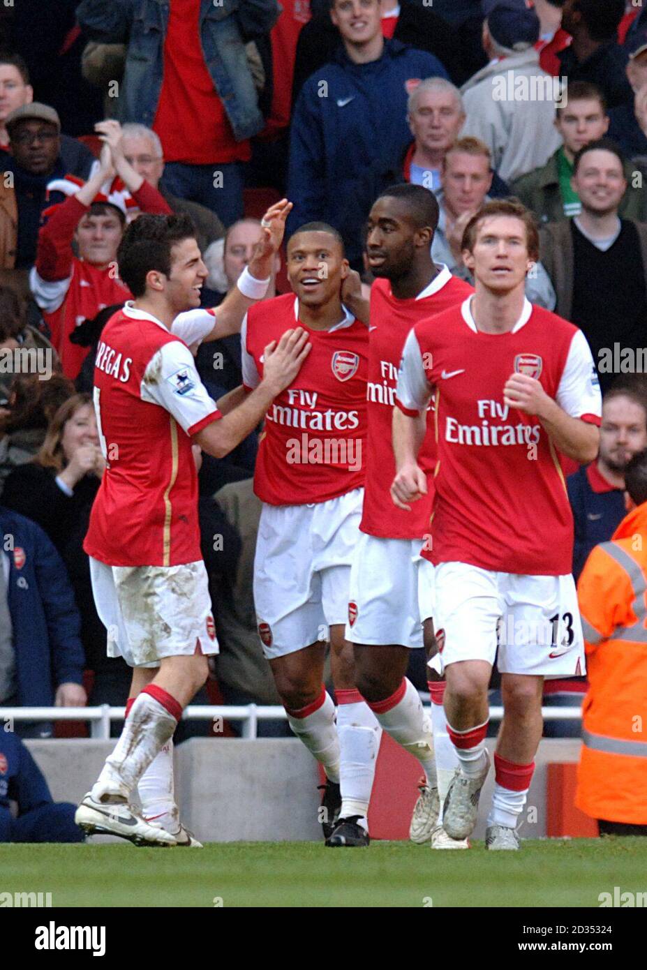 Arsenal's Cesar Julio Baptista celebrates with teammates after scoring ...