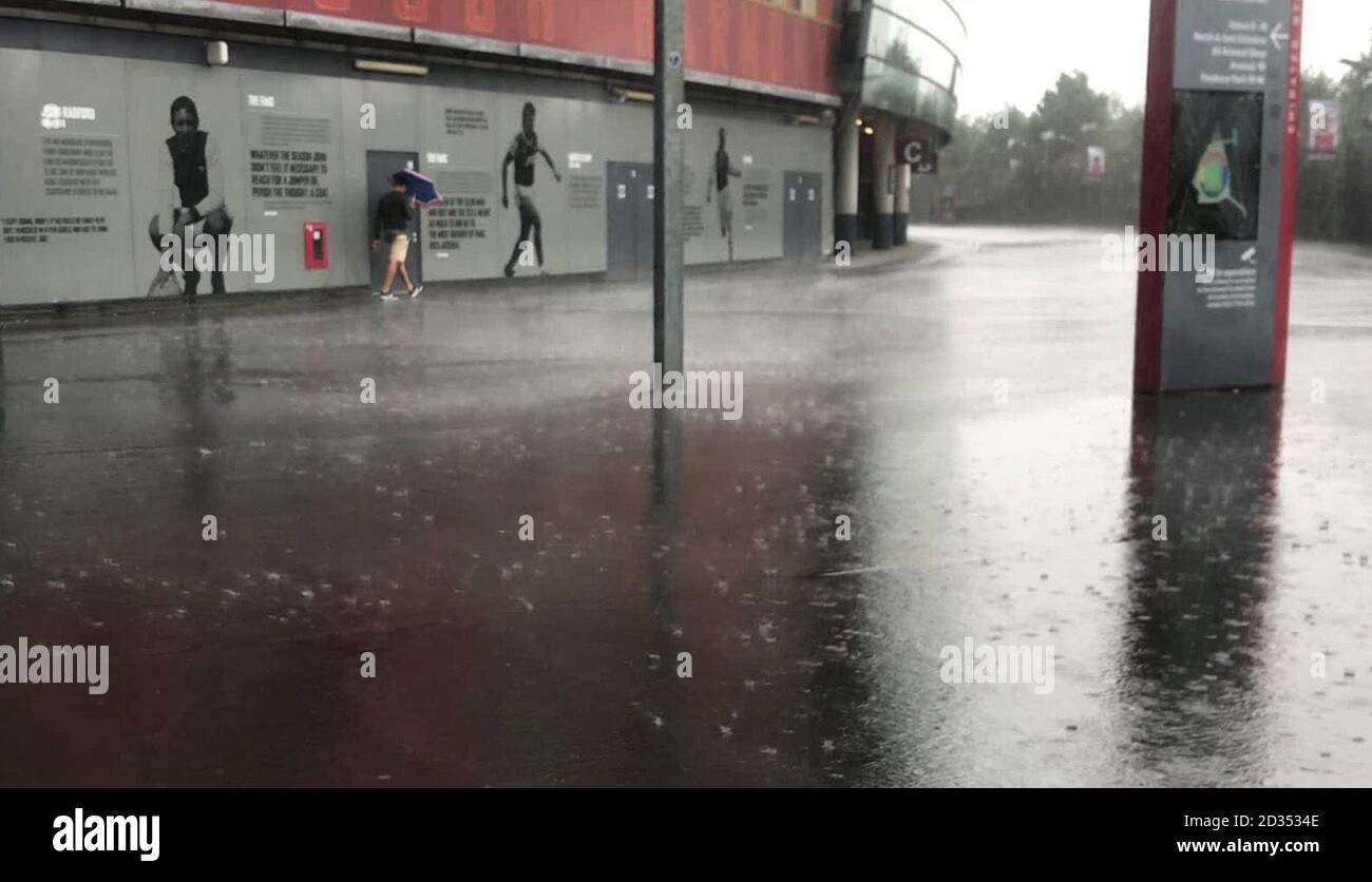 Heavy rain falls at the Emirates Stadium, north London as warnings for ...