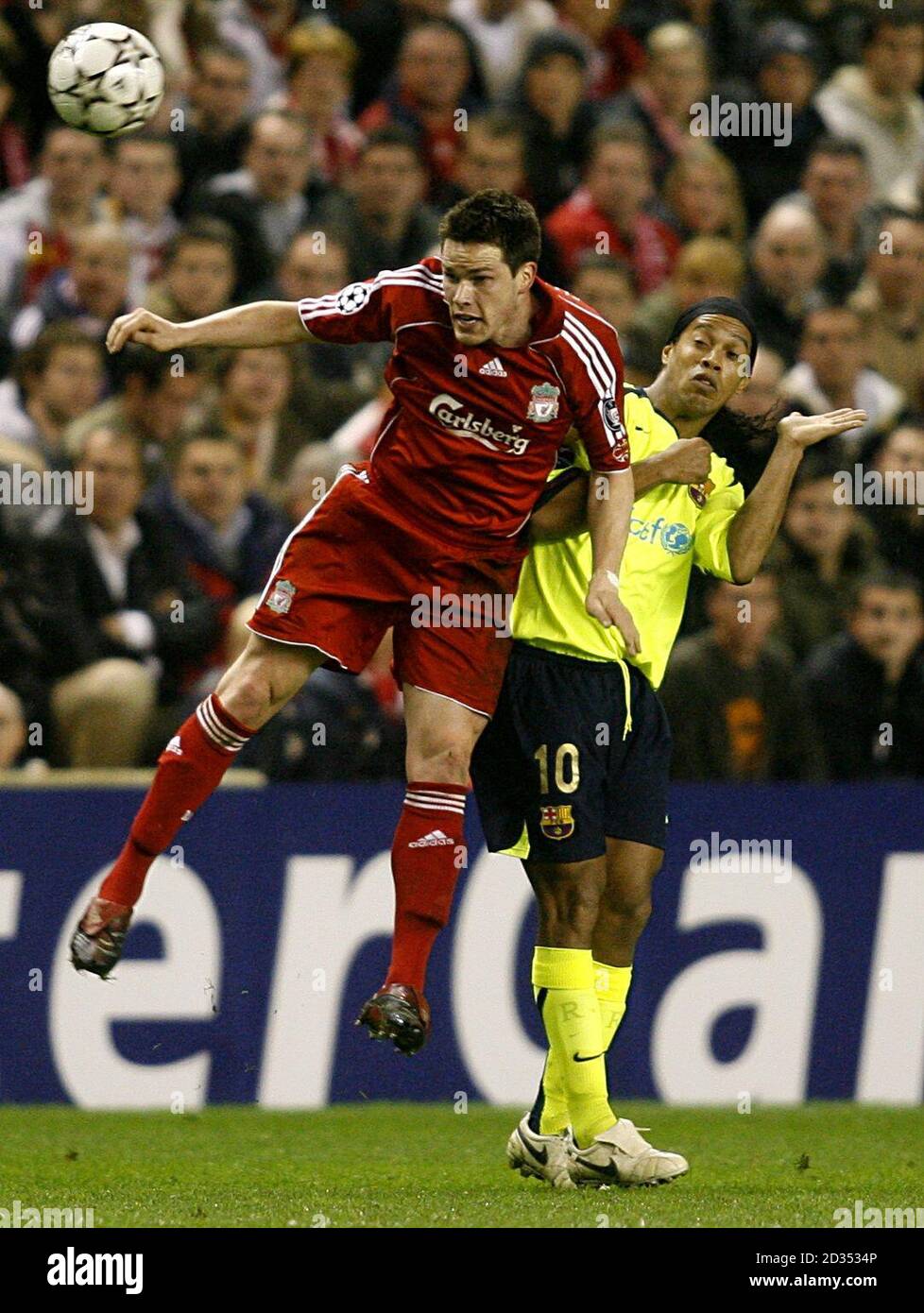 Liverpool's Steve Finnan wins the header as Barcelona's Ronaldinho ...