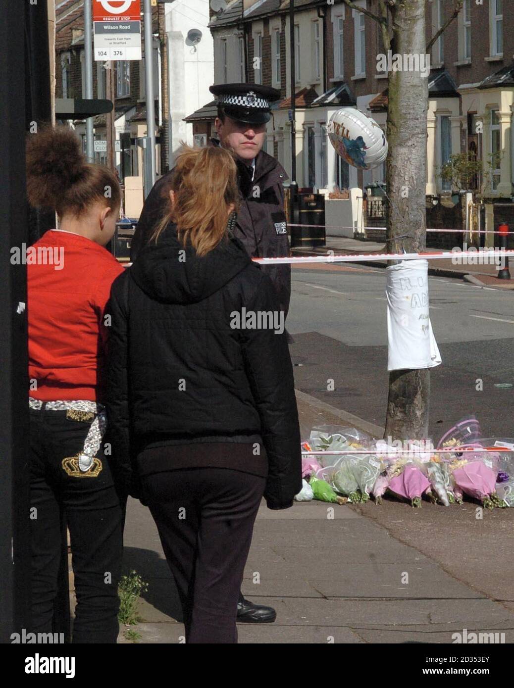 Floral tributes left by schoolfriends at the scene where Adam Regis was ...