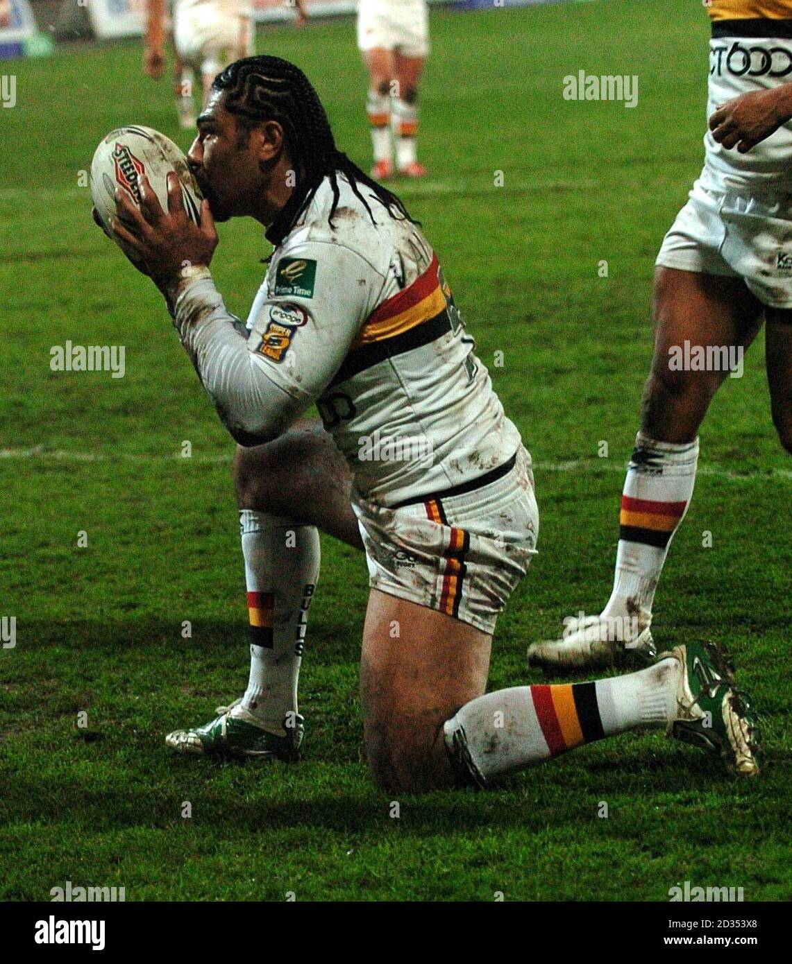 Bradford Bulls' Lesley Vainikolo kisses the ball to celebrate his try ...