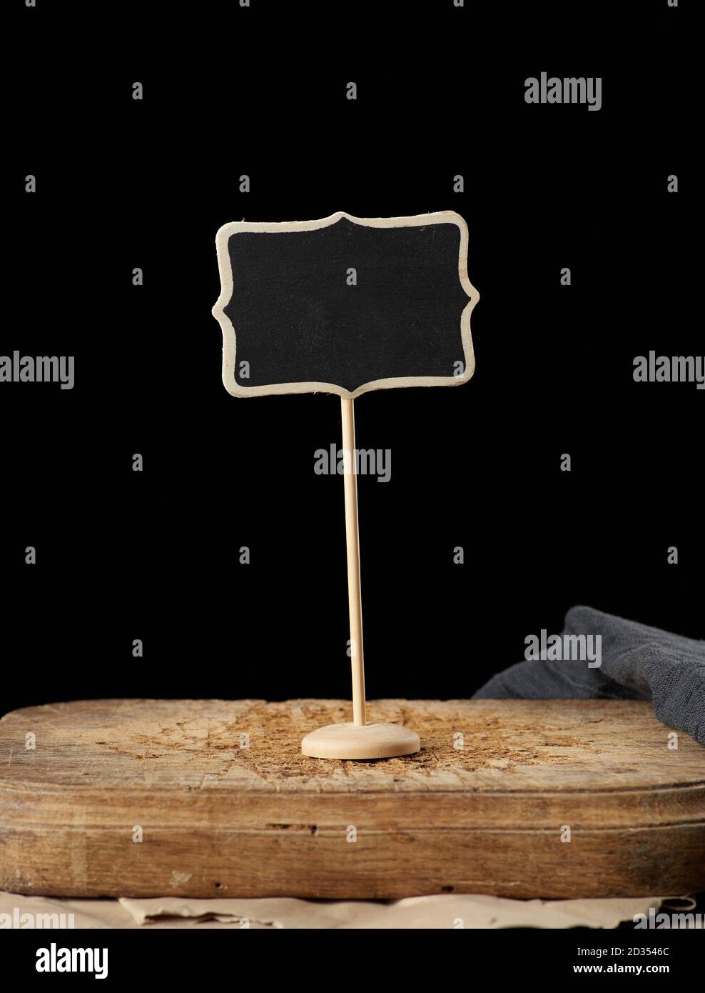 wooden pointer on a stick for writing text, black background, close up ...