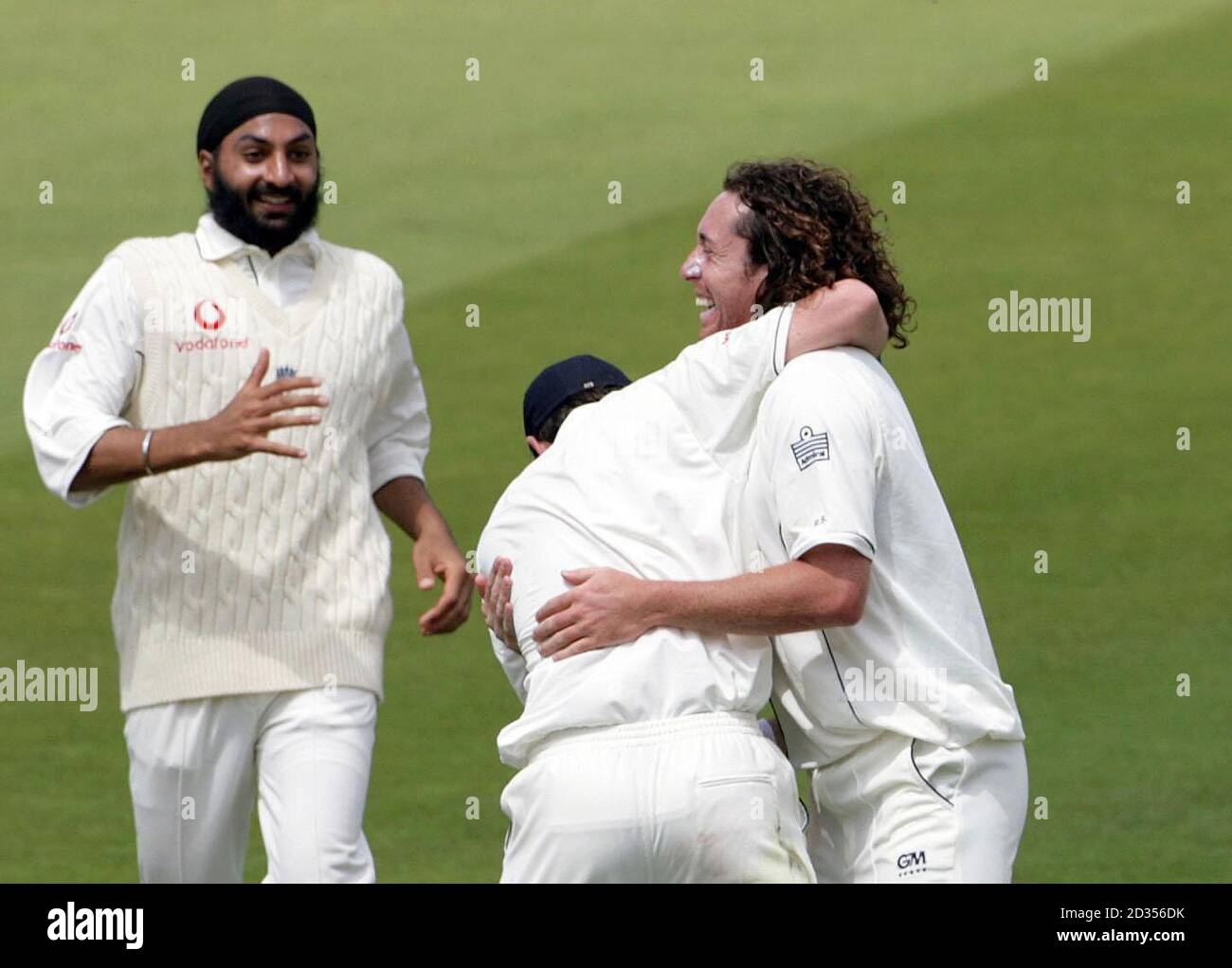 England's Ryan Sidebottom (right) celebrates taking the wicket of India ...