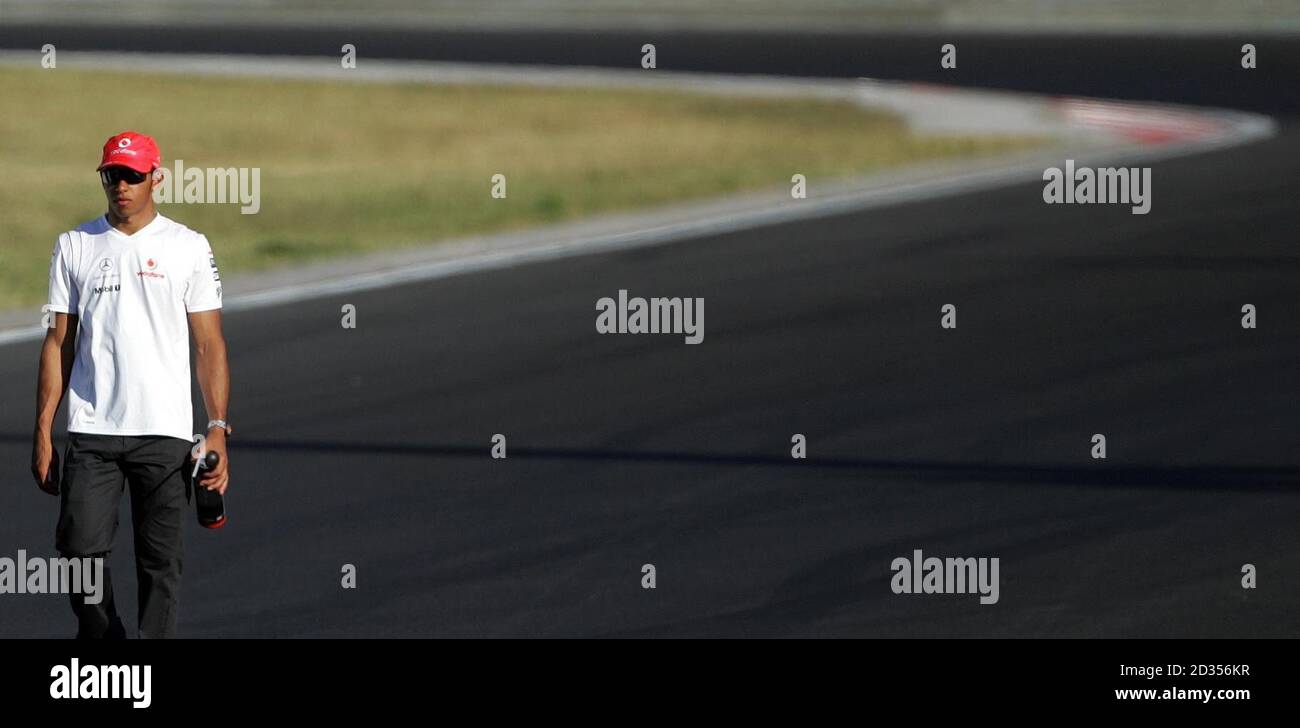 Lewis Hamilton takes a walk around at the Hungaroring circuit, near ...