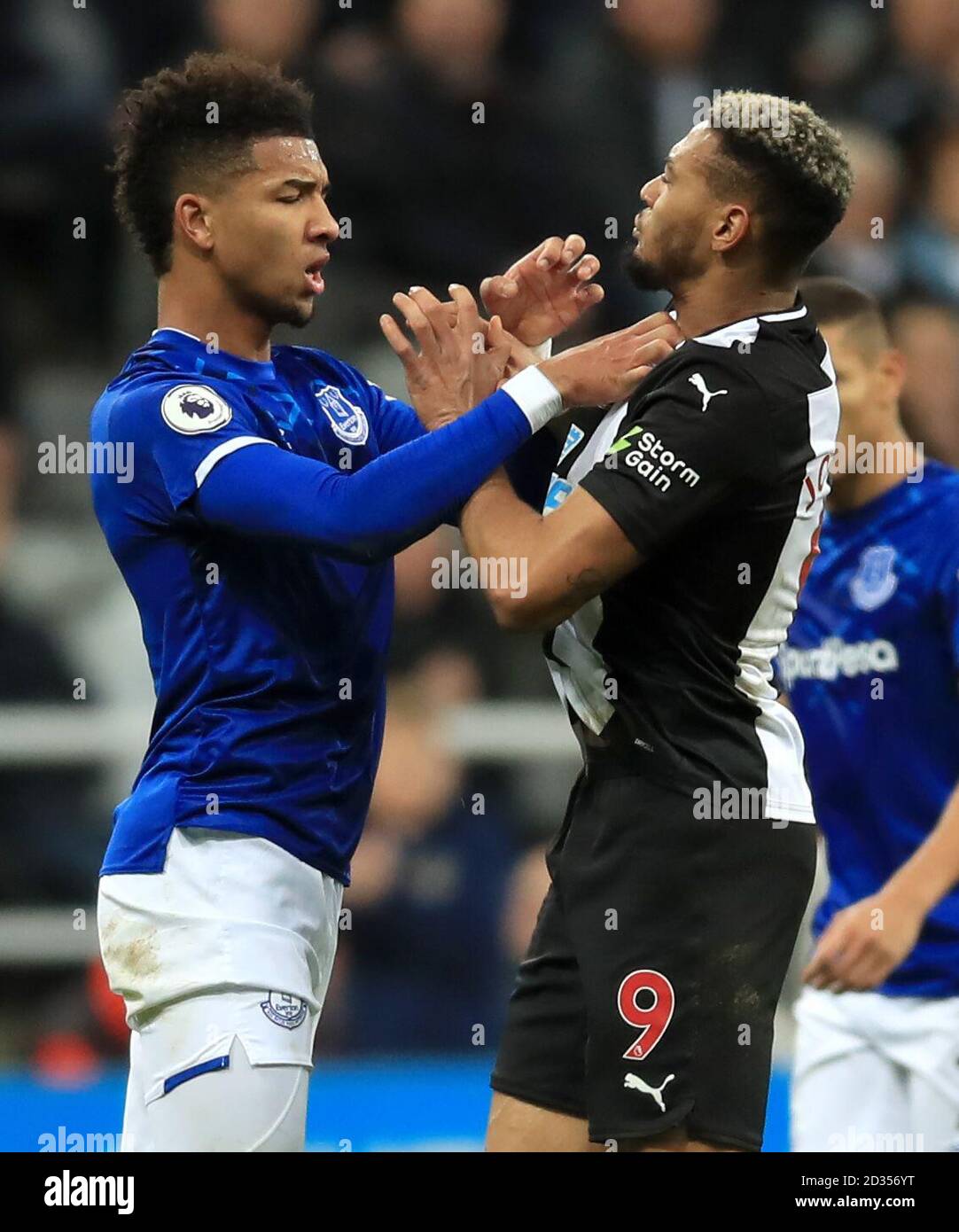 Tempers flare between Everton's Mason Holgate (left) and Newcastle ...