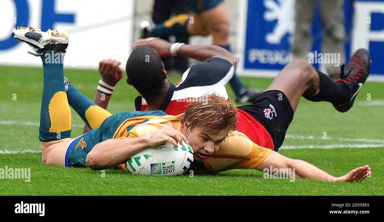 Australia's Drew Mitchell goes over for a try during the IRB Rugby ...