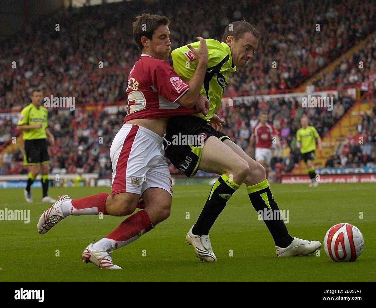 Bristol City's Lee Johnson and Sheffield United's Alan Quinn (right ...