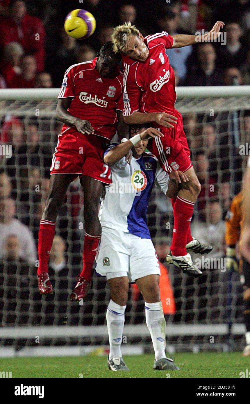 Liverpool's Mohamed Sissoko (left) and Sami Hyypia (right) battle for ...
