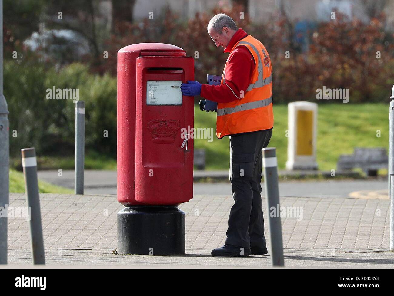 A royal mail postman empties hi-res stock photography and images - Alamy