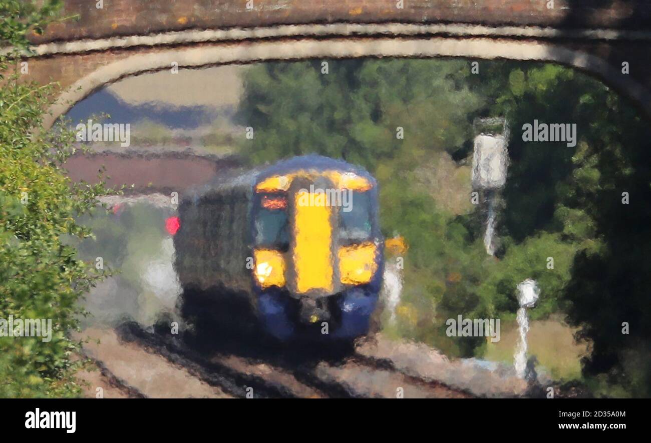 A train passes through the shimmering heat from railway lines in ...