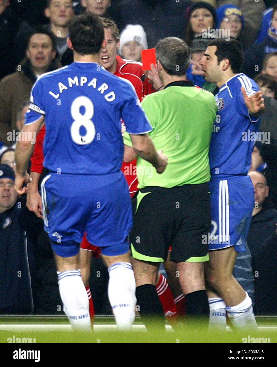 Liverpool's Peter Crouch is dismissed by referee Martin Atkinson Stock ...