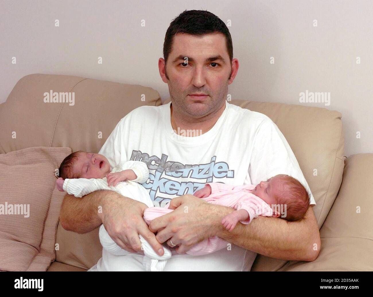 Ryan Finkill, 38, with his twin girl daughters Isabelle (left) and ...