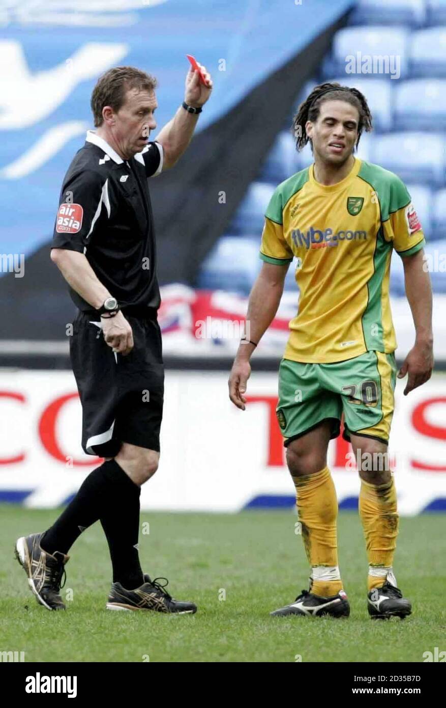 Norwich's Darel Russell is shown the red card during the Coca-Cola ...