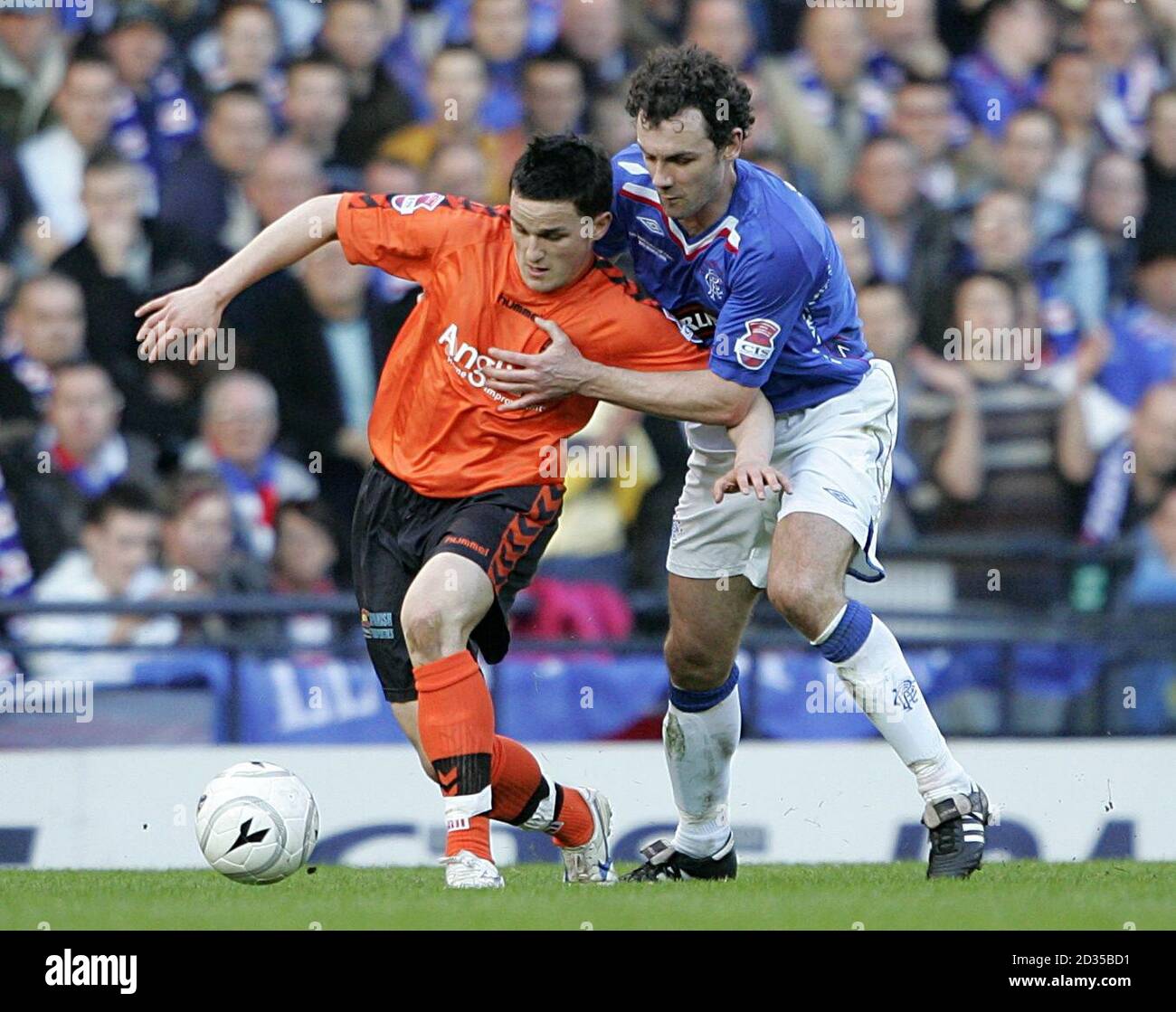 Rangers' Christian Dailly (r) and Dundee United's Craig Conway battle ...