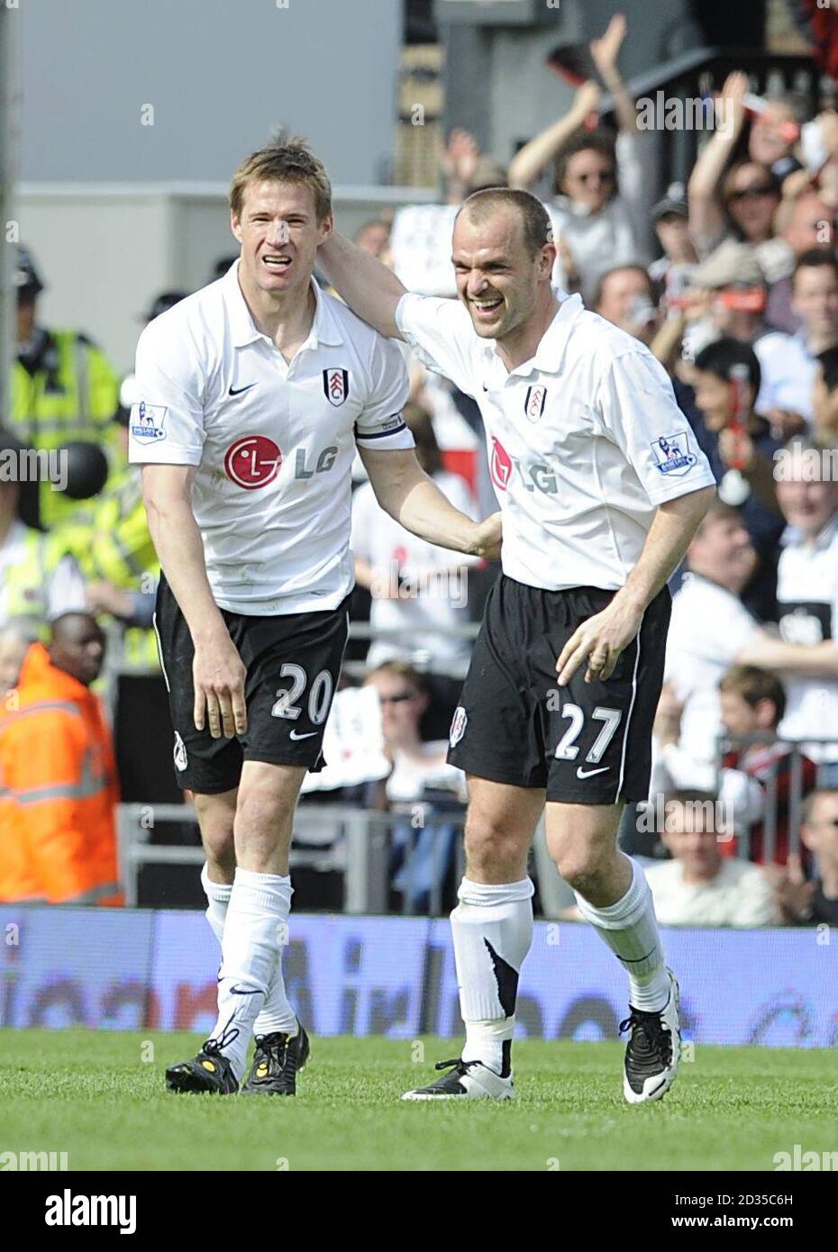 Fulham's Danny Murphy congratulates team mate Brian McBride after ...
