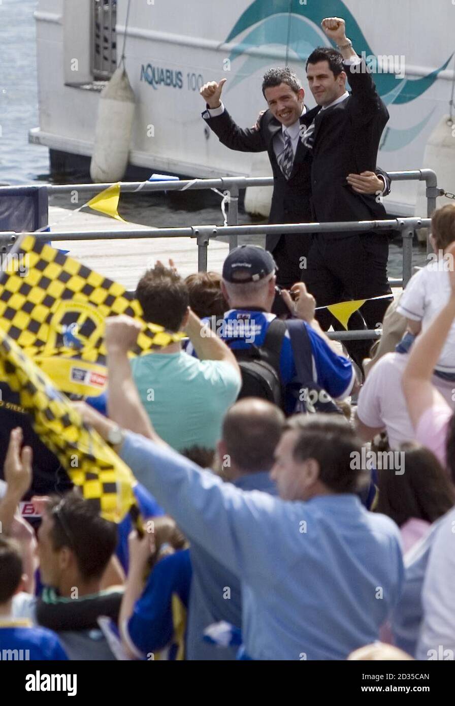Kevin McNaughton and Steve Thompson wave to the thousands of Cardiff ...