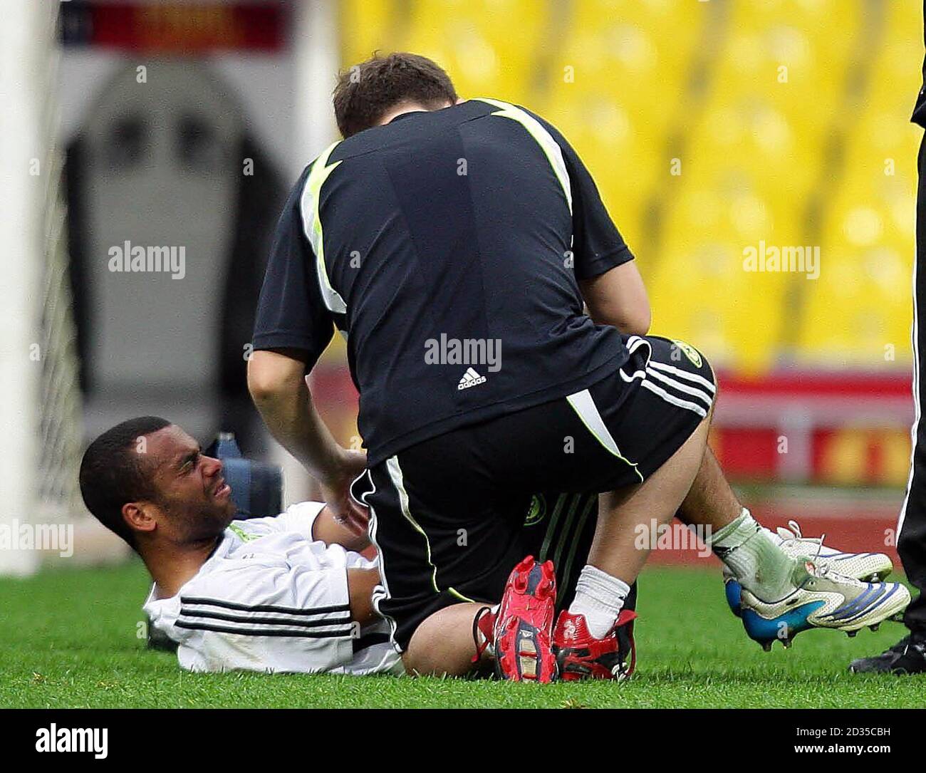 Chelsea's Ashley Cole in pain after a challenge from Claude Makelele ...