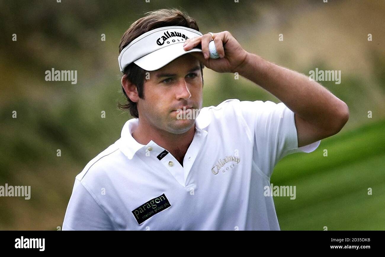 England's Robert Rock tips his cap after finishing Six under par on the ...