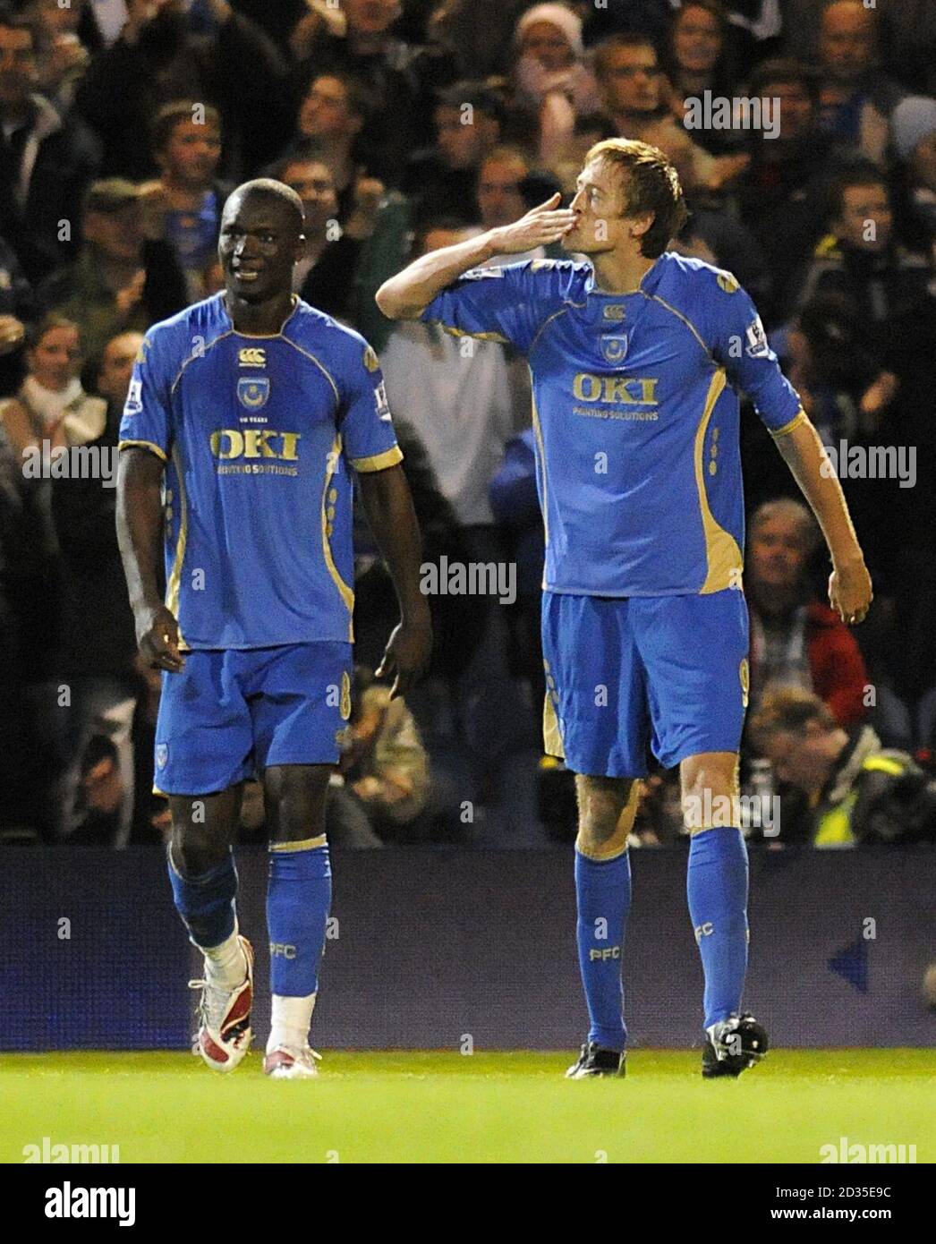 Portsmouth's Peter Crouch (right) celebrates scoring the first goal of ...