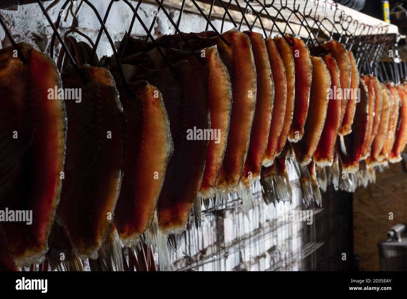 smoked fish carcasses are raised in a row after smoking on the air Cold ...
