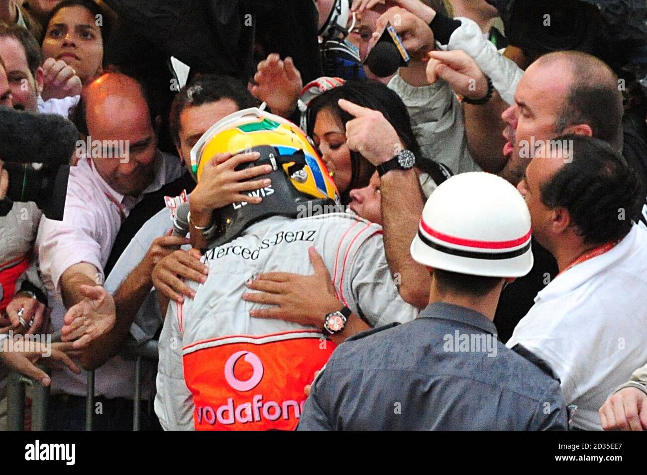 McLaren Mercedes' Lewis Hamilton of Great Britain receives a kiss from ...