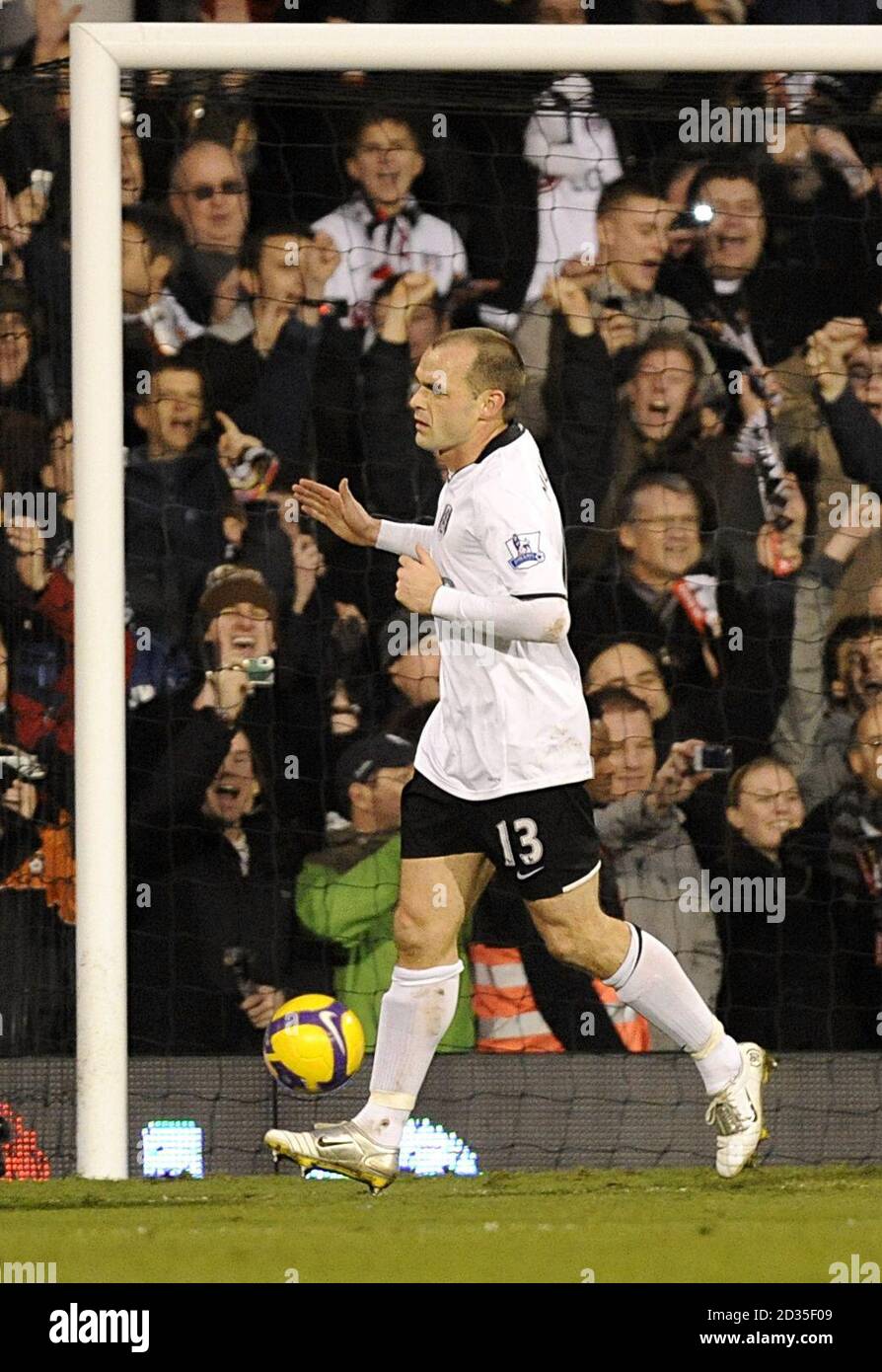 Fulham's Danny Murphy (right) celebrates scoring his sides second goal ...