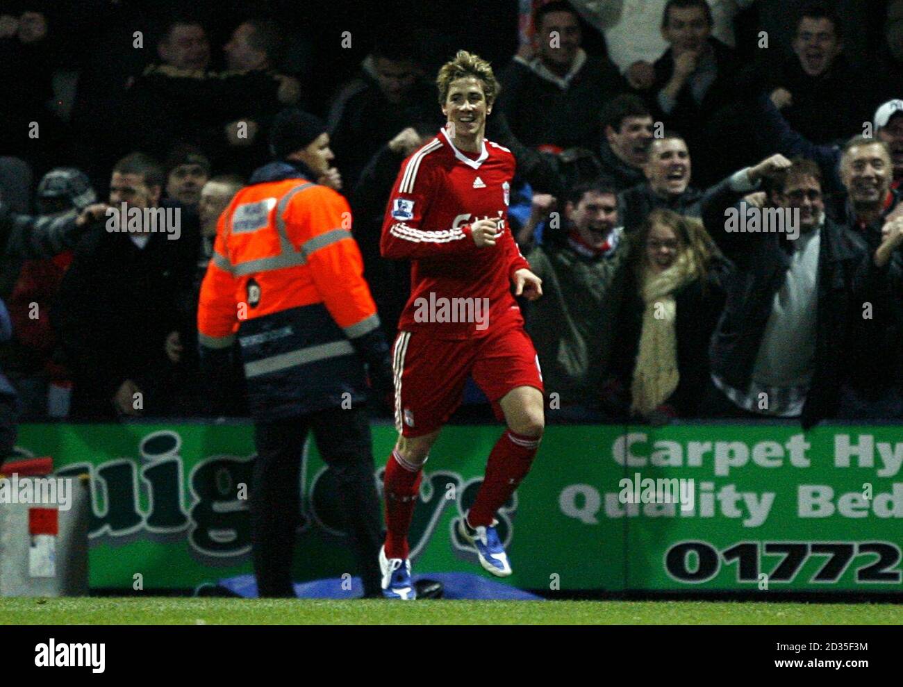 Liverpool's Fernando Torres celebrates scoring his sides second goal ...
