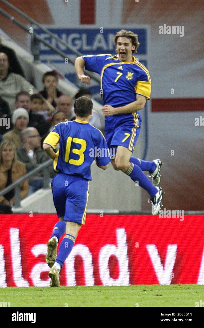 Ukraine's Andriy Shevchenko (right) celebrates scoring his sides first ...