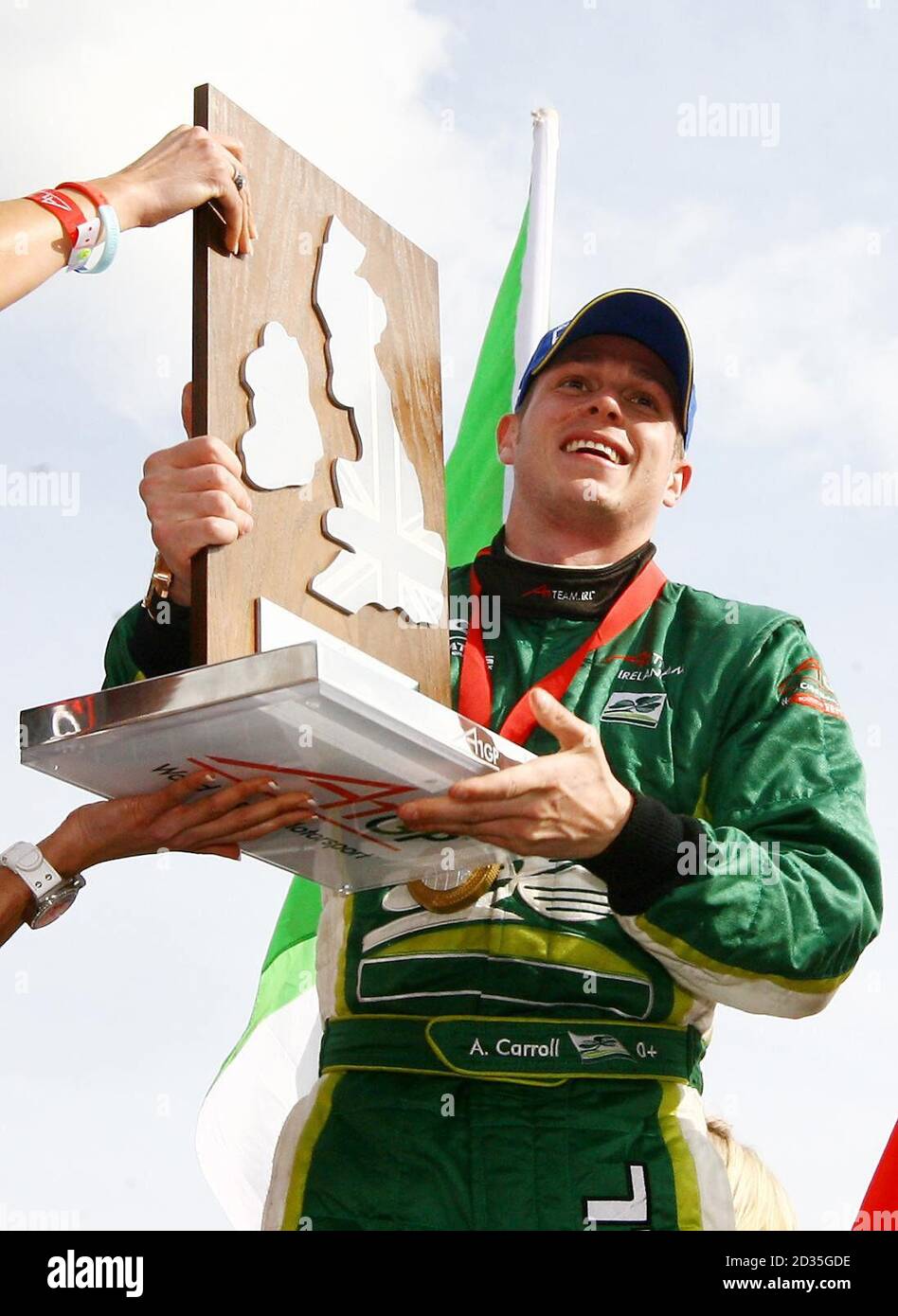 Ireland's Adam Carroll celebrates victory in the feature race and ...