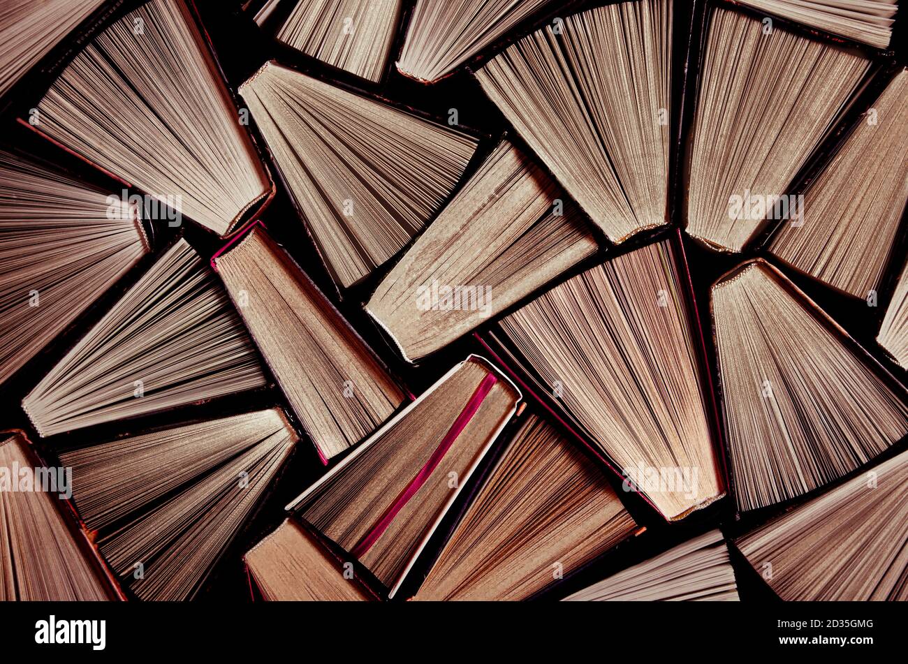 Book background from multi-colored open books from the home library ...