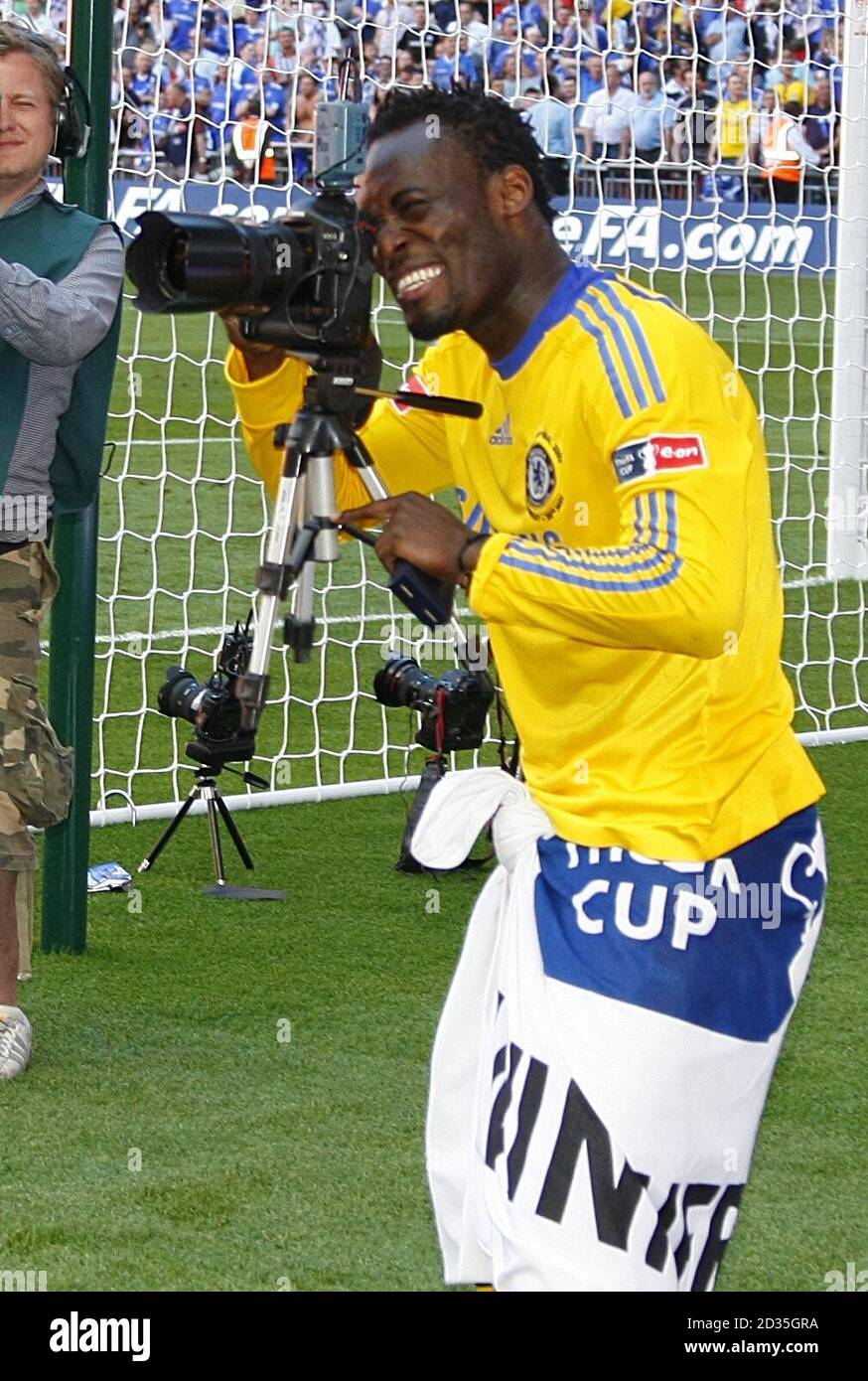 Chelsea's Michael Essien takes photographs with a photographers camera ...