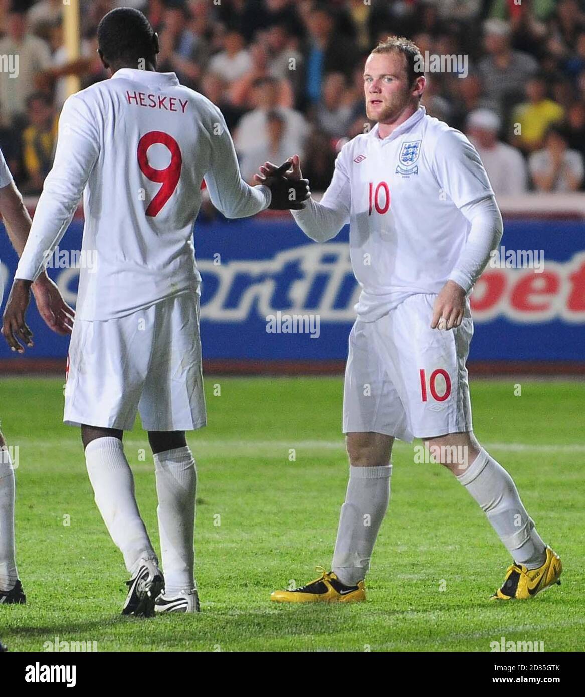England's Wayne Rooney celebrates his goal with Emile Heskey during the ...