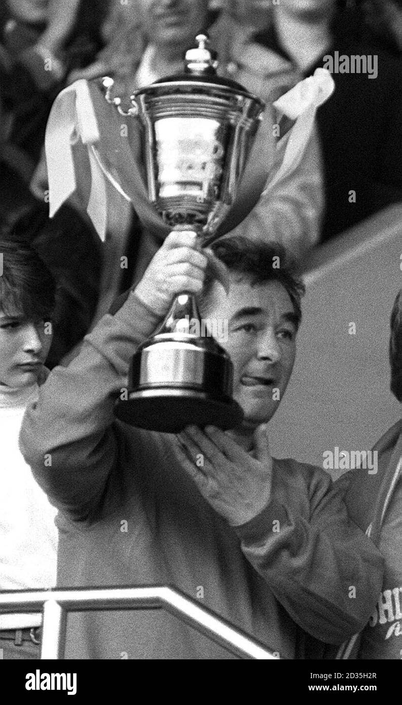 Nottingham Forest manager Brian Clough holds the Simod Cup aloft after ...
