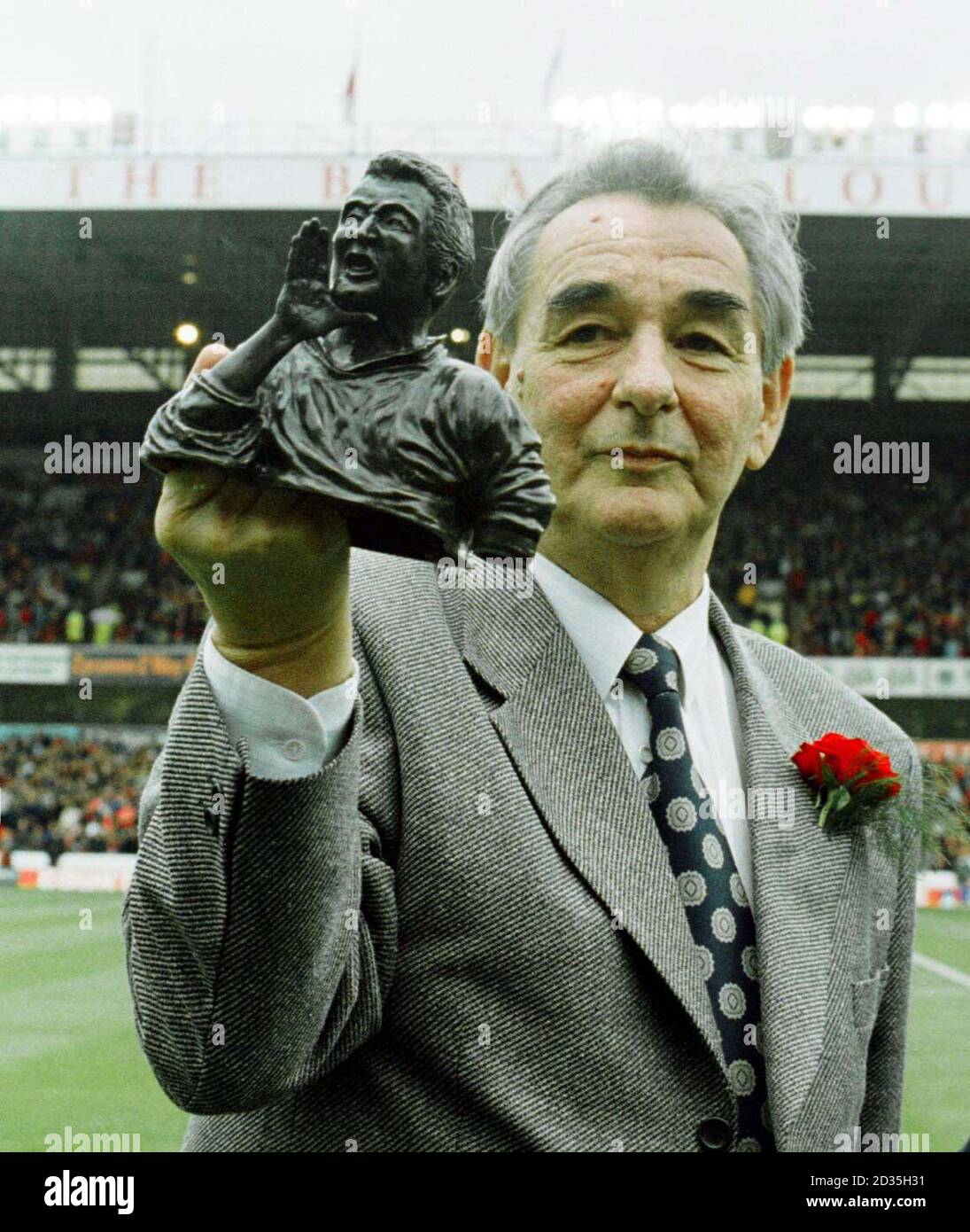 Former Nottingham Forest manager Brian Clough shows off the bronze bust ...