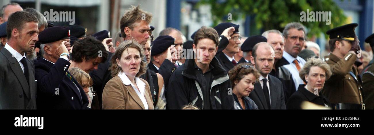 Unidentified mourners react as the coffins of Trooper Joshua Hammond 18 ...