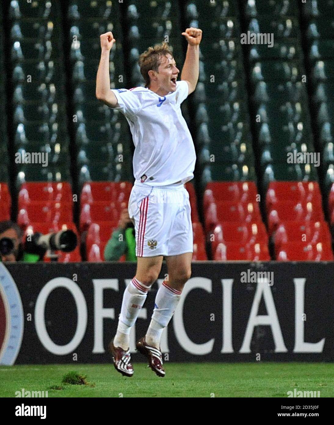 Russia's Roman Pavlyuchenko celebrates scoring his sides third goal ...