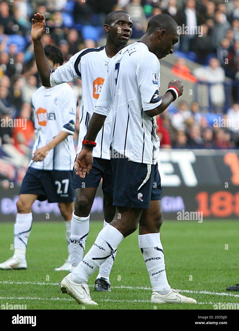 Bolton Wanderers' Fabrice Muamba (right) walks off the pitch after ...