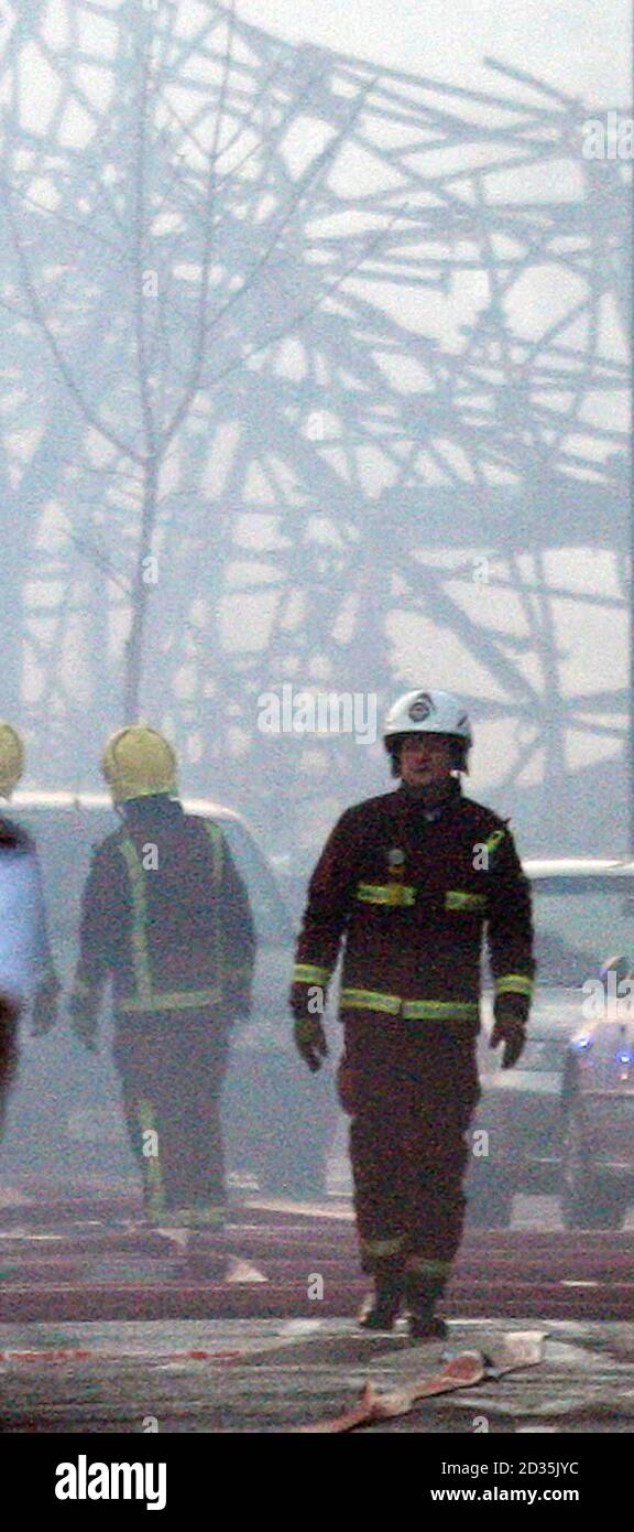 RECROPPED VERSION OF PREVIOUSLY TRANSMITTED PHOTOGRAPH. Firefighters at ...