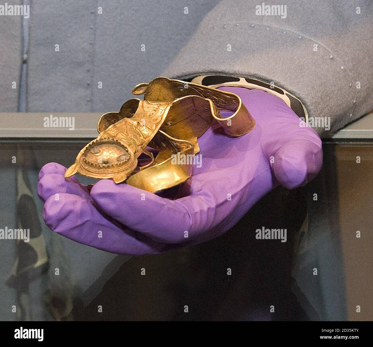 The Duchess of Cornwall holds an exhibit from the Staffordshire Hoard ...