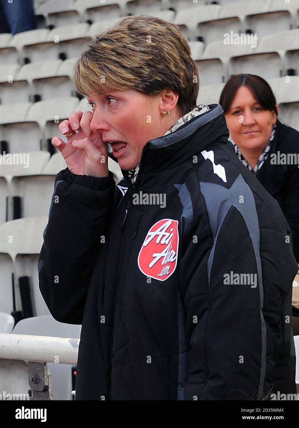 Michelle Halsey wipes a tear from her eye as husband and referee Mark ...