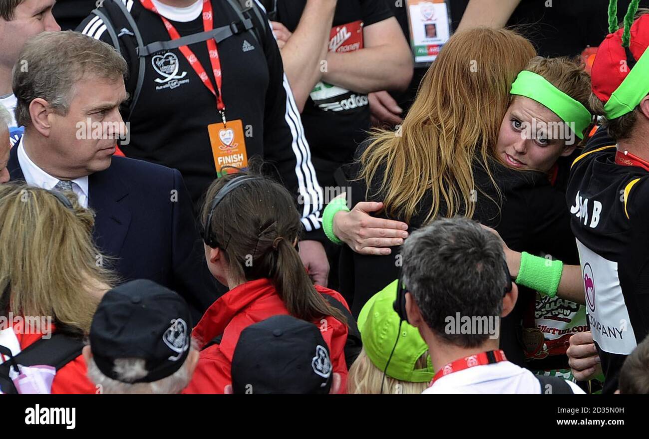 Princess Beatrice (right) is hugged by the Duchess of York as Prince ...