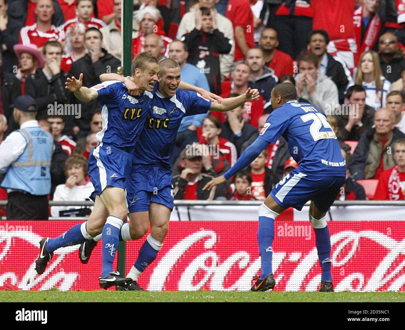 Millwall's Paul Robinson (left) celebrates with his team mates after ...