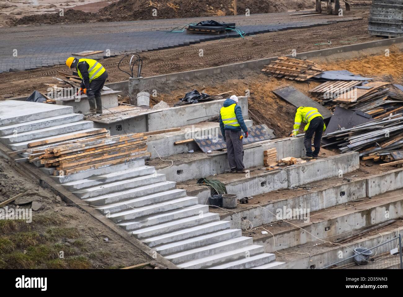Builders working on construction foundation. Man strengthen concrete ...