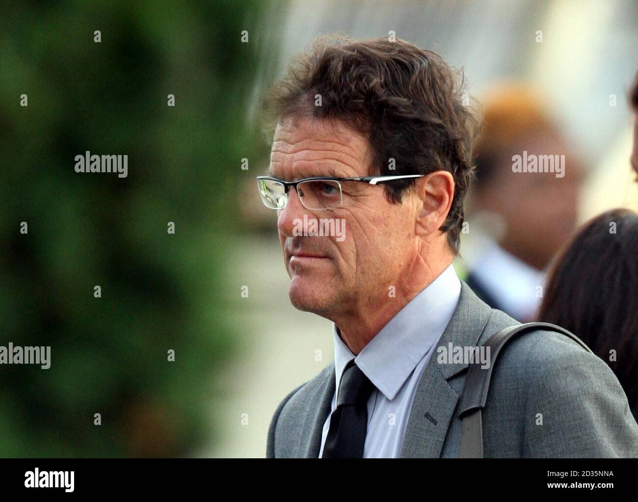 England manager fabio capello arrives at heathrow airport hi-res stock ...